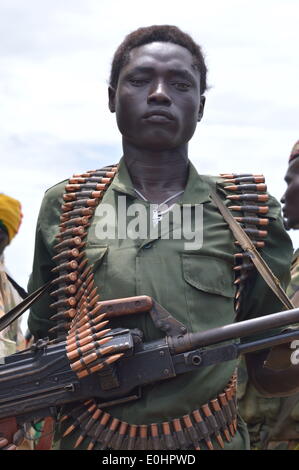 Gumuruk, Jonglei, South Sudan. 13th May, 2014. Priest holds up signed ...