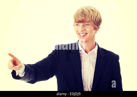 Businessman points something Stock Photo - Alamy