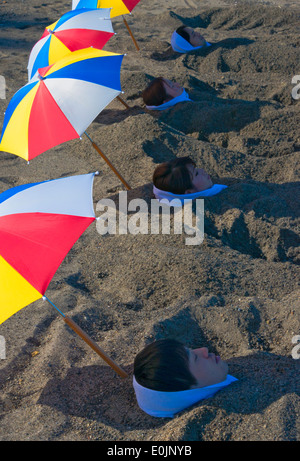 Tourists receiving steam sand bath, Ibusuki, Kagoshima Prefecture ...