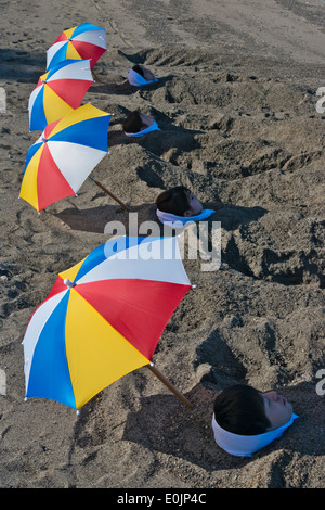 Tourists receiving steam sand bath, Ibusuki, Kagoshima Prefecture ...