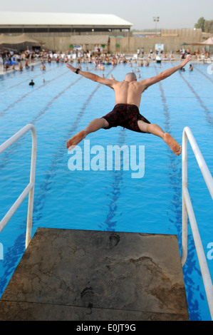 A pilot with the 332nd Air Expeditionary Wing shows Maj. Gen. Blake C ...