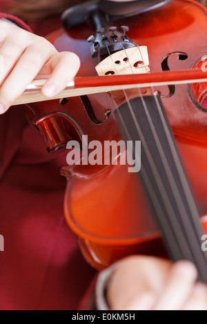 girl playing fiddle by bow close up isolated on white background Stock ...