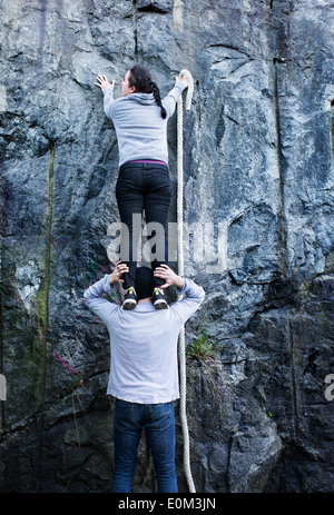 Teamwork concept with the people carrying team letters Stock Photo - Alamy