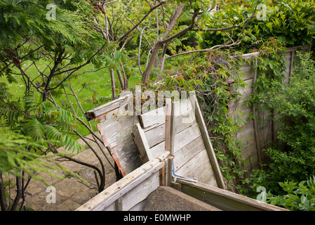 An old worn wooden fence falling over and in need of repair Stock Photo ...