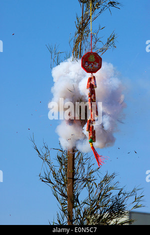 Asian firecrackers exploding at a Vietnamese lunar New Year festival ...