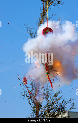 Asian firecrackers exploding at a Vietnamese lunar New Year festival ...