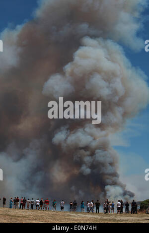 Firefighters watch as a wildfire burns in Yucaipa, Calif., Saturday ...