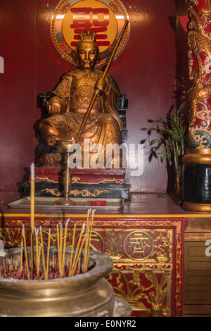 A statue of the Chinese Monkey King, Sun Wukong, outside a shop for ...