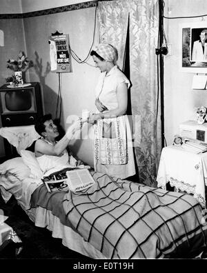 British pop singer Terry Dene gets a haircut from Rifleman G P ...