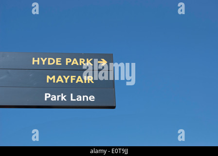 Sign giving direction to Hyde Park - Mayfair underground passenger ...