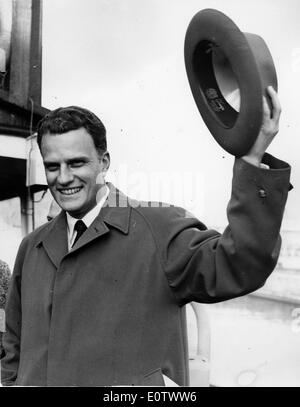 Evangelist Billy Graham waves a greeting as he arrives in Los Angeles ...