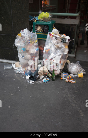 waste overflowing bin full of fast food litter Stock Photo - Alamy