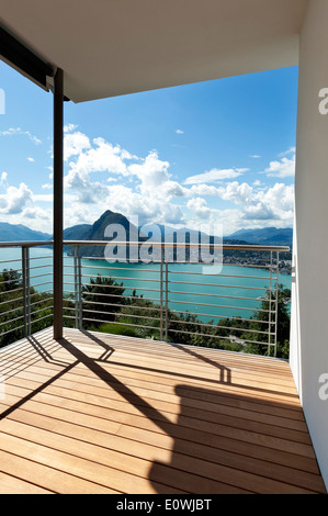 Modern apartment, balcony overlooking the lake Stock Photo - Alamy