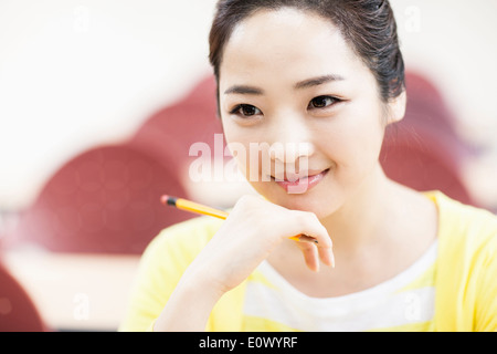 a woman studying in class Stock Photo - Alamy
