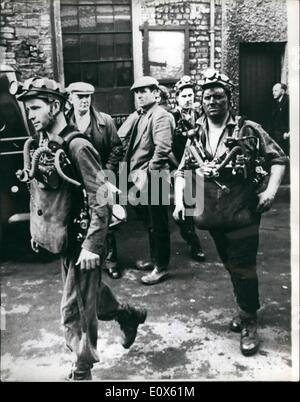 Cambrian Colliery Disaster at Tonypandy. Miners stand at the pit head ...
