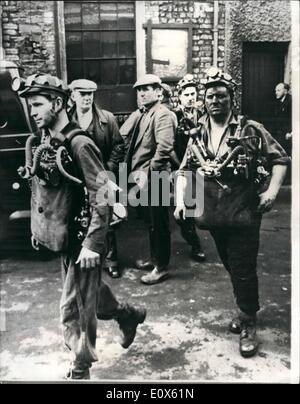 Cambrian Colliery Disaster at Tonypandy. Miners stand at the pit head ...