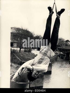 Upside Down Straight Jacket Escape man tied up hanging upside down by a ...