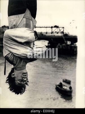 Upside Down Straight Jacket Escape man tied up hanging upside down by a ...