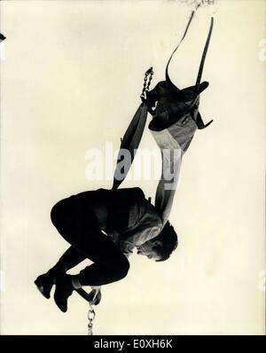 Upside Down Straight Jacket Escape man tied up hanging upside down by a ...