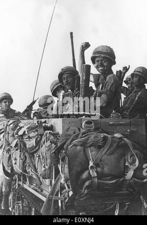 Israeli soldiers drive a tanks on the border with Lebanon in northern ...