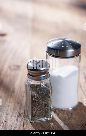 Salt and Pepper shaker on a wooden table Stock Photo - Alamy