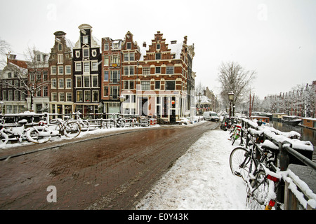 Snowy Amsterdam in winter in the Netherlands Europe at sunset Stock ...