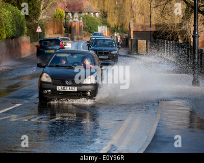UK, Surrey, Cobham, flood water on road splash Stock Photo - Alamy