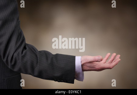 A businessman reaching out to offer assistance Stock Photo - Alamy