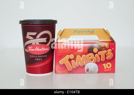 A Tim Hortons coffee cup and Timbits (doughnut holes, donut holes ...