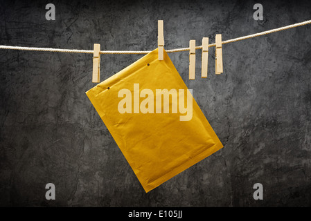 Mail envelope on rope Stock Photo - Alamy