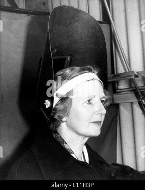 Prime Minister Margaret Thatcher wears protective clothing as she tours ...