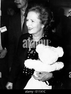 Prime Minister Margaret Thatcher with a teddy bear, presented to her at ...