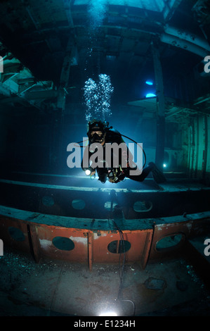 Diver inside wreck Stock Photo - Alamy