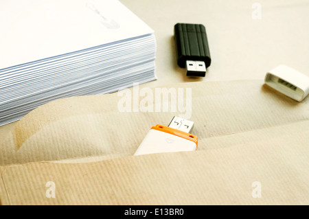 Stacked envelopes and flash drives Stock Photo - Alamy