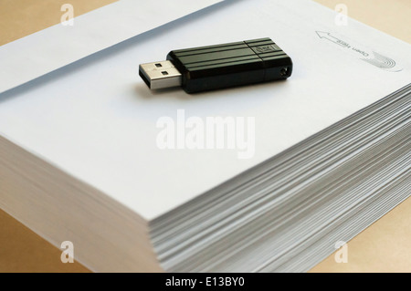 Stack envelopes and flash drive Stock Photo - Alamy