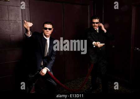2 security guards or FBI agents in a humorous pose wearing sunglasses ...