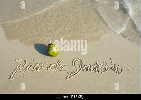Rio de Janeiro message handwritten on smooth sand beach with clean copy ...
