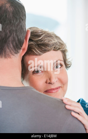 Spain, Mallorca, Palma, Couple hugging at harbour, smiling Stock Photo ...