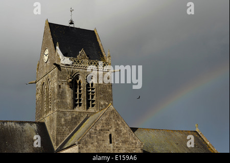 Parachute memorial on tower of church, Sainte-Mere-Eglise, Normandy ...