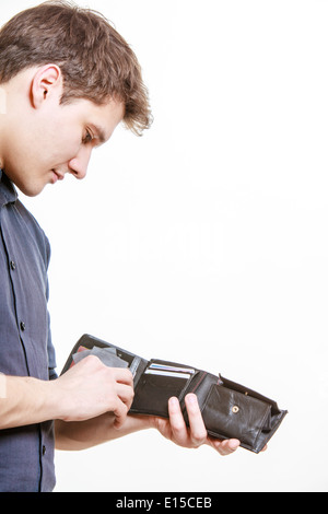 Careless man putting wallet in pocket Stock Photo - Alamy