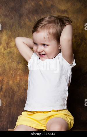 Portrait of baby 1-2 years old. Happy caucasian child girl playing toys ...