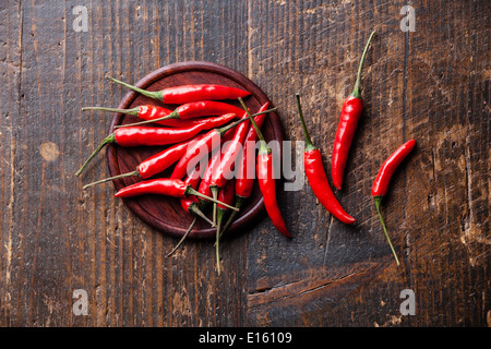 Chili peppers on wooden background. Red and green chile peppers ...
