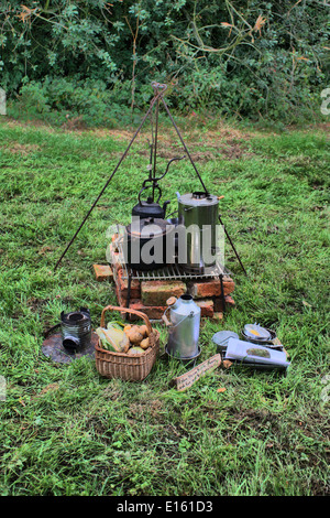 old fashioned cooking pots over an open fire Stock Photo - Alamy