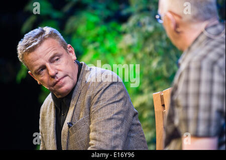 Suggs talking about his early life and years as a musician on stage at ...