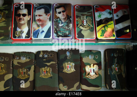 Damascus, Damascus. 25th May, 2014. Photos of Syrian President Bashar ...