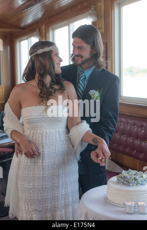 A vertical shot of a newly married couple walking Stock Photo - Alamy