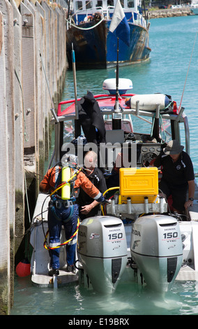 Commercial diver diving in Napier Port North Island New Zealand Stock ...