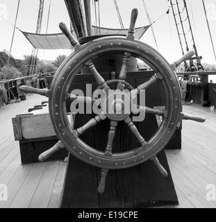 Ship helm on white wooden background Stock Photo - Alamy