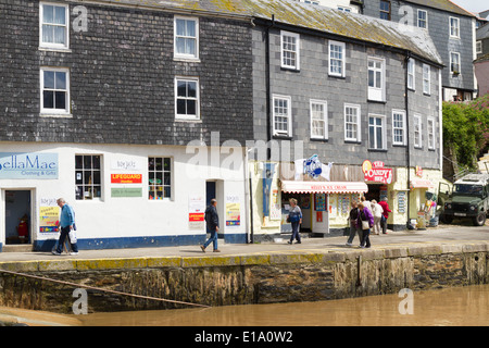 Shops, pubs and cafes around the harbour of Mevagissey in Cornwall ...