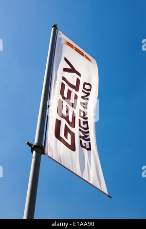 The flag of Geely over blue sky. Geely is a Chinese automotive ...